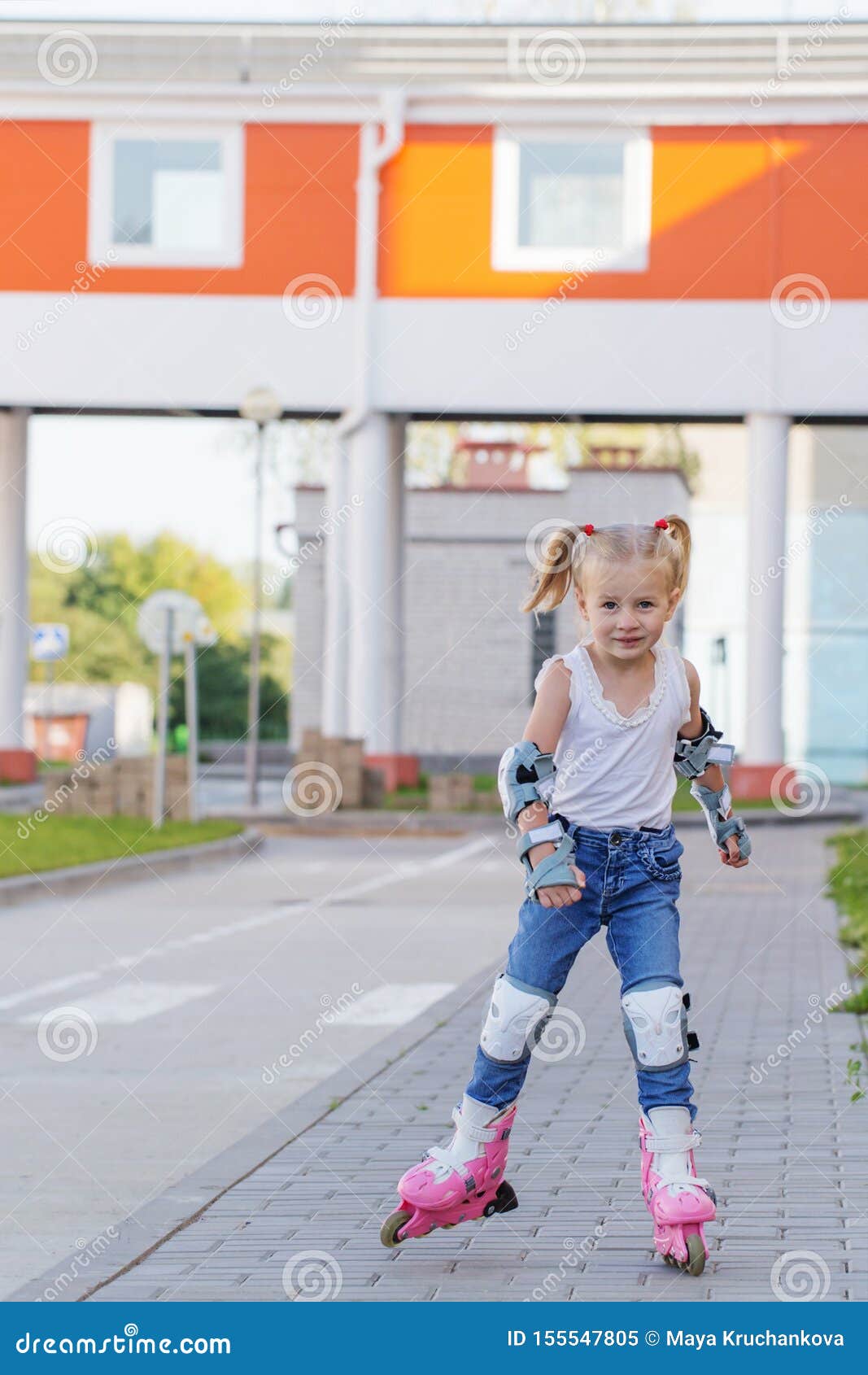 Little Girl Rides Inline Skates Stock Image - Image of person ...