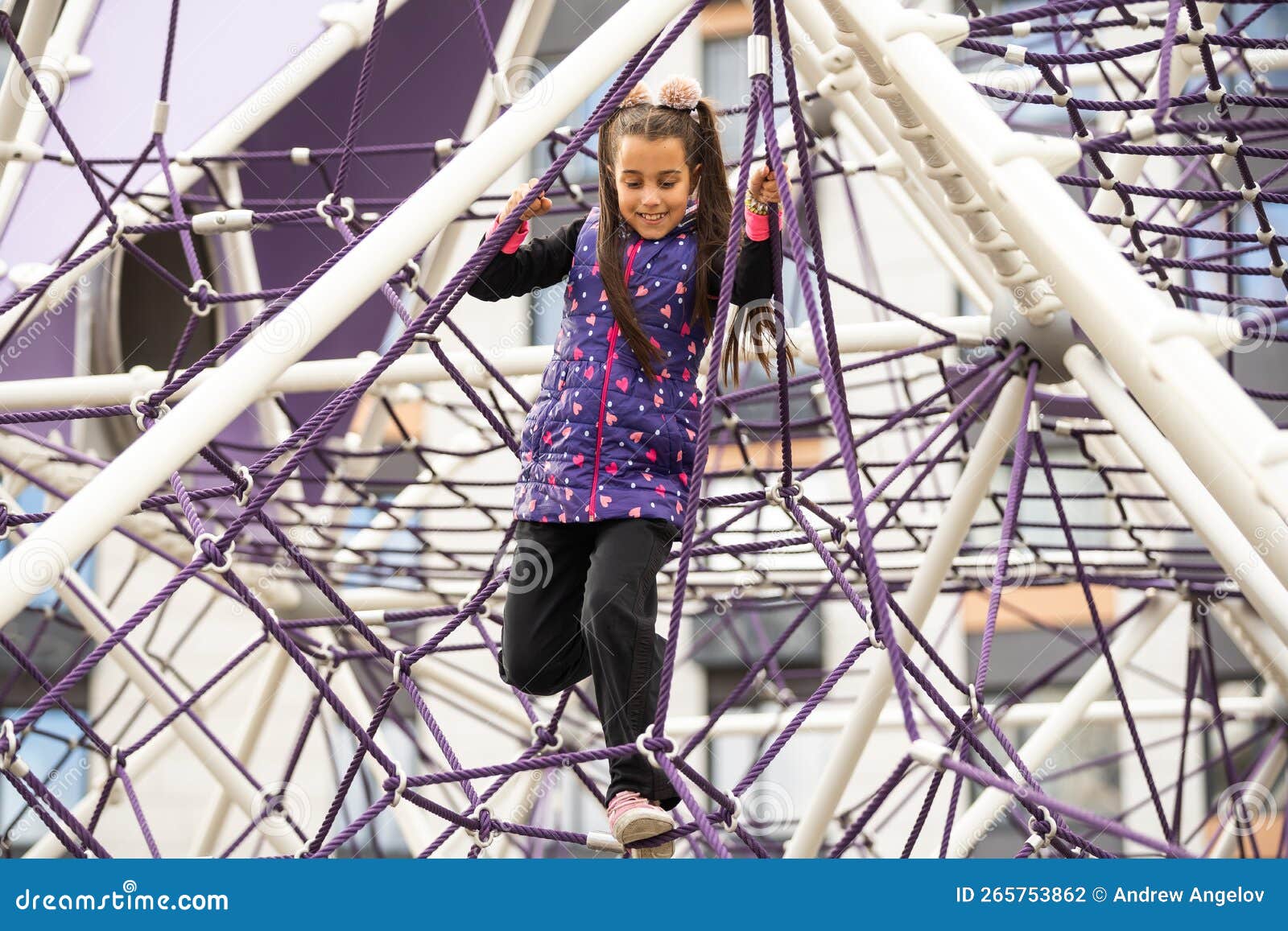 Little girl in a rope maze stock photo. Image of child - 265753862