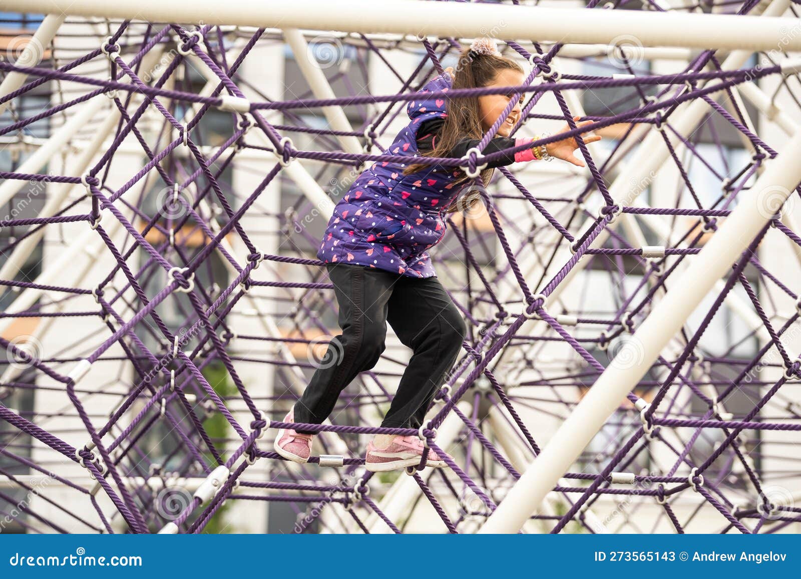 Little girl in a rope maze stock image. Image of high - 273565143