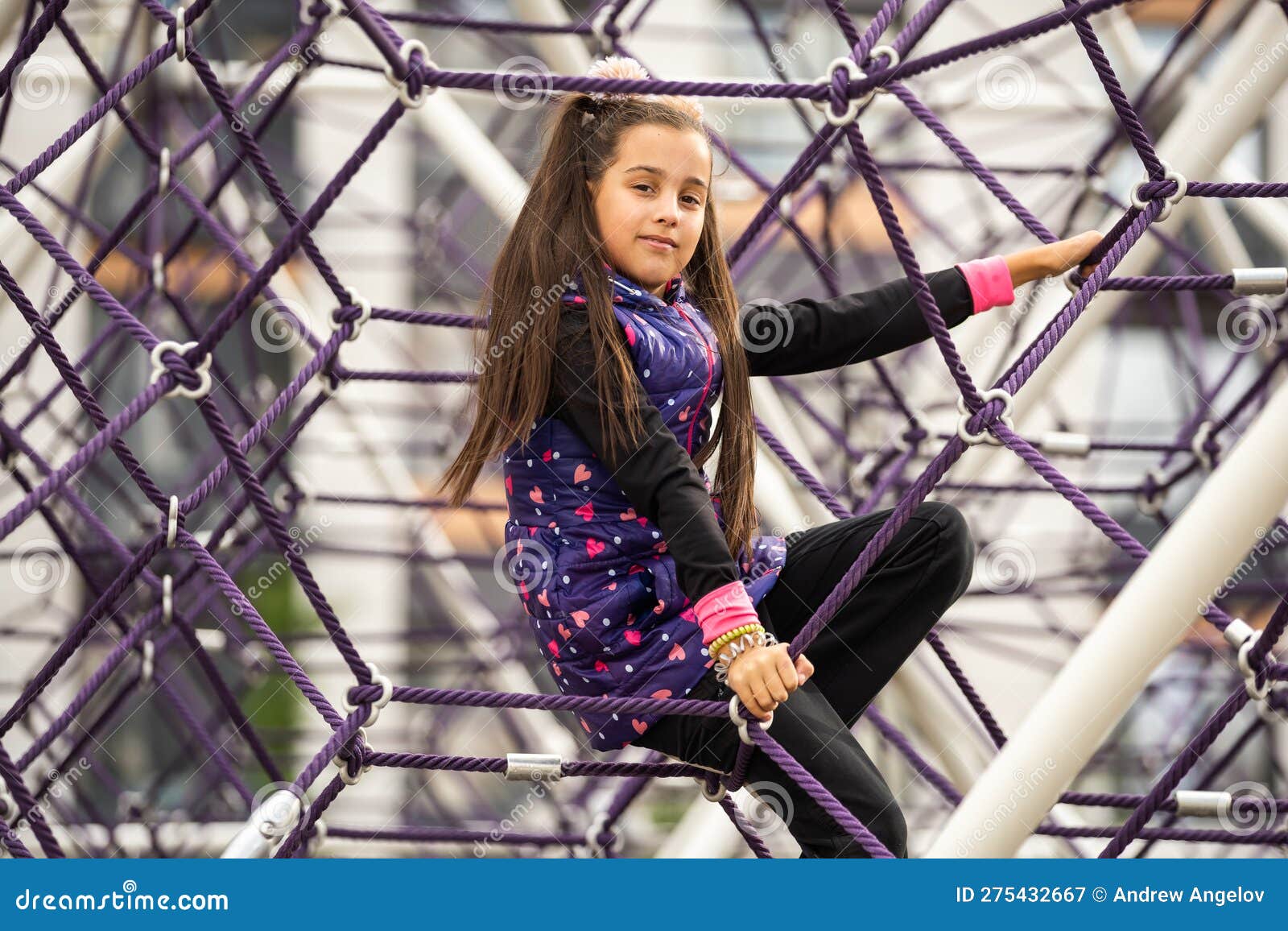 Little girl in a rope maze stock image. Image of interior - 275432667