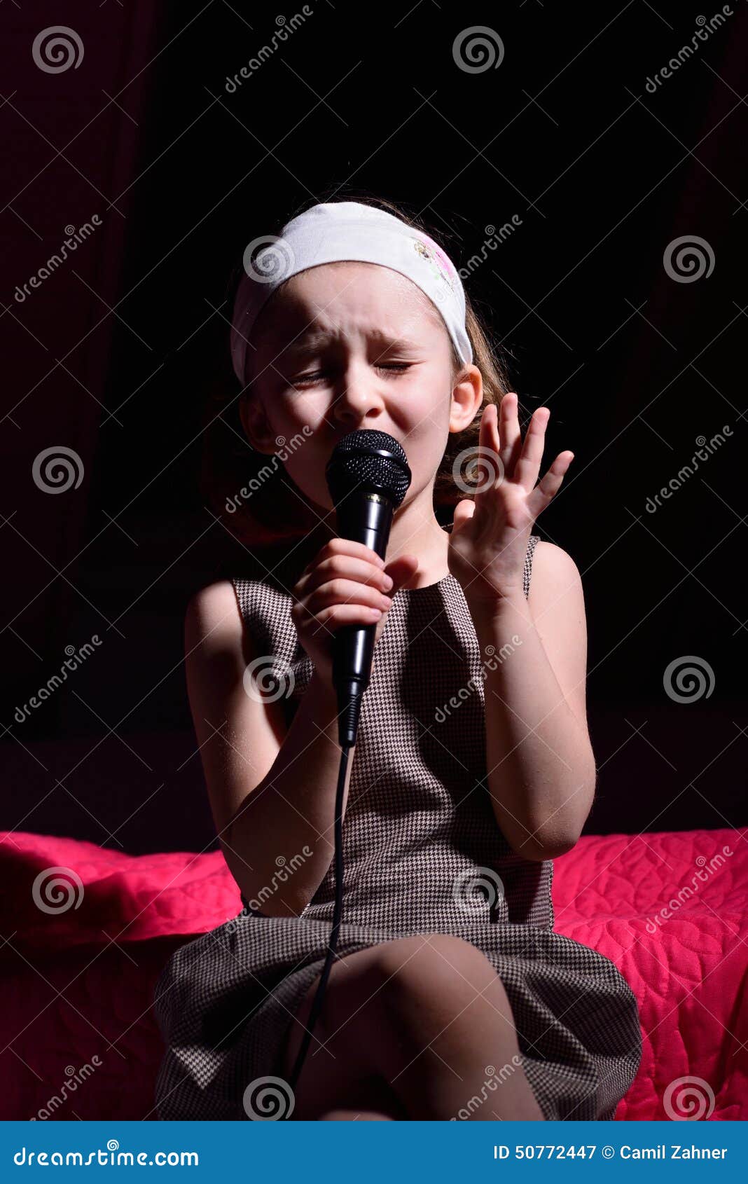 Little girl singing stock image. Image of music, black - 50772447