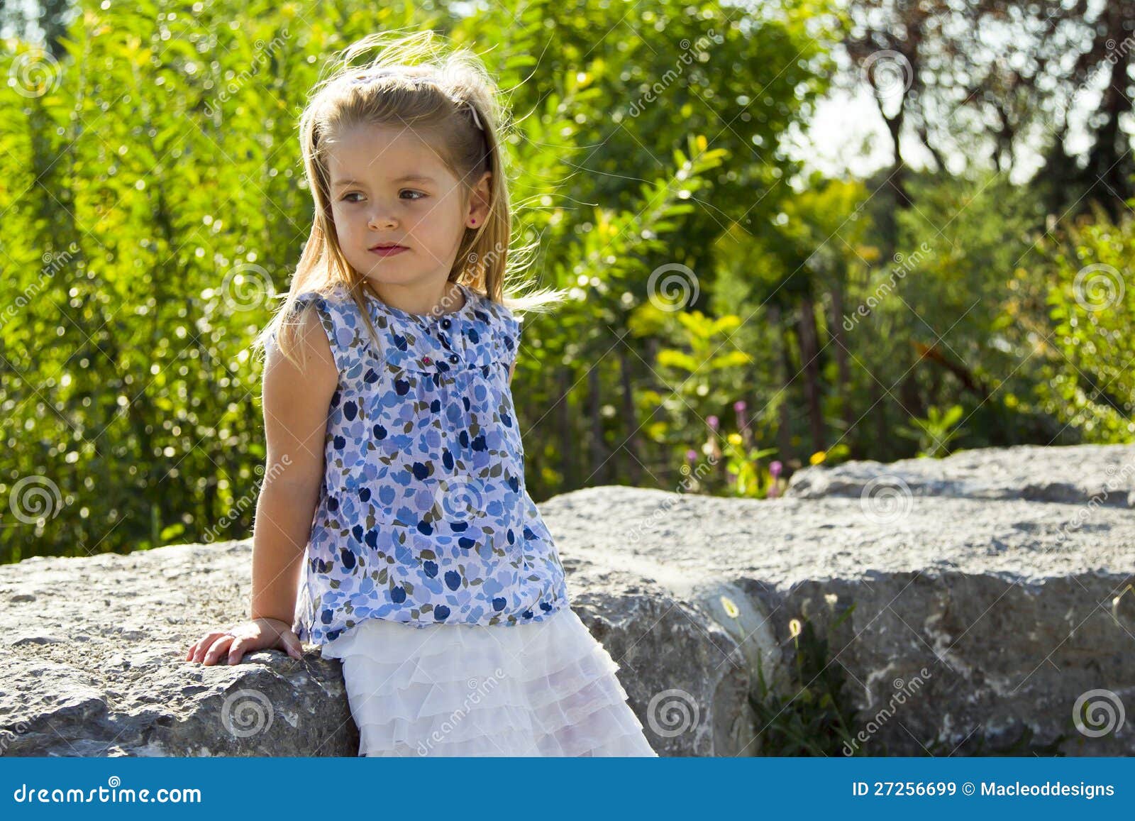 A Little Girl Sits on a Rock Stock Image - Image of happiness, outdoor ...