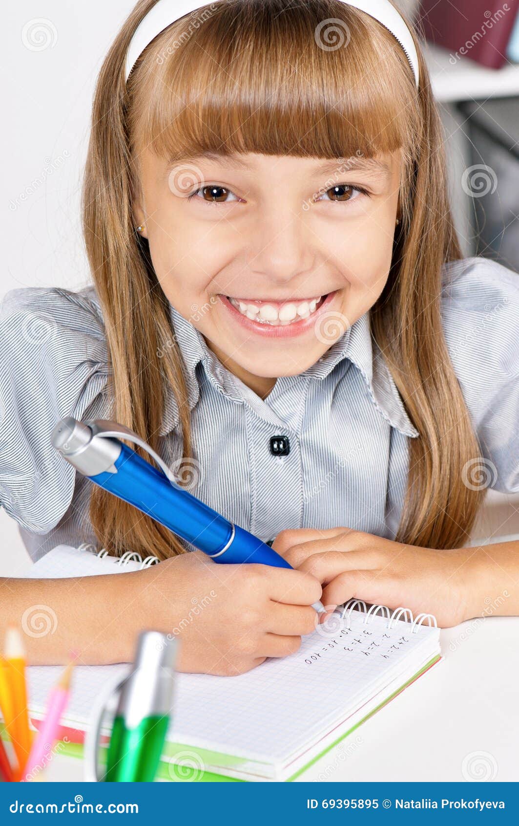 Little Girl Sitting at Desk in the Classroom Stock Image - Image of ...