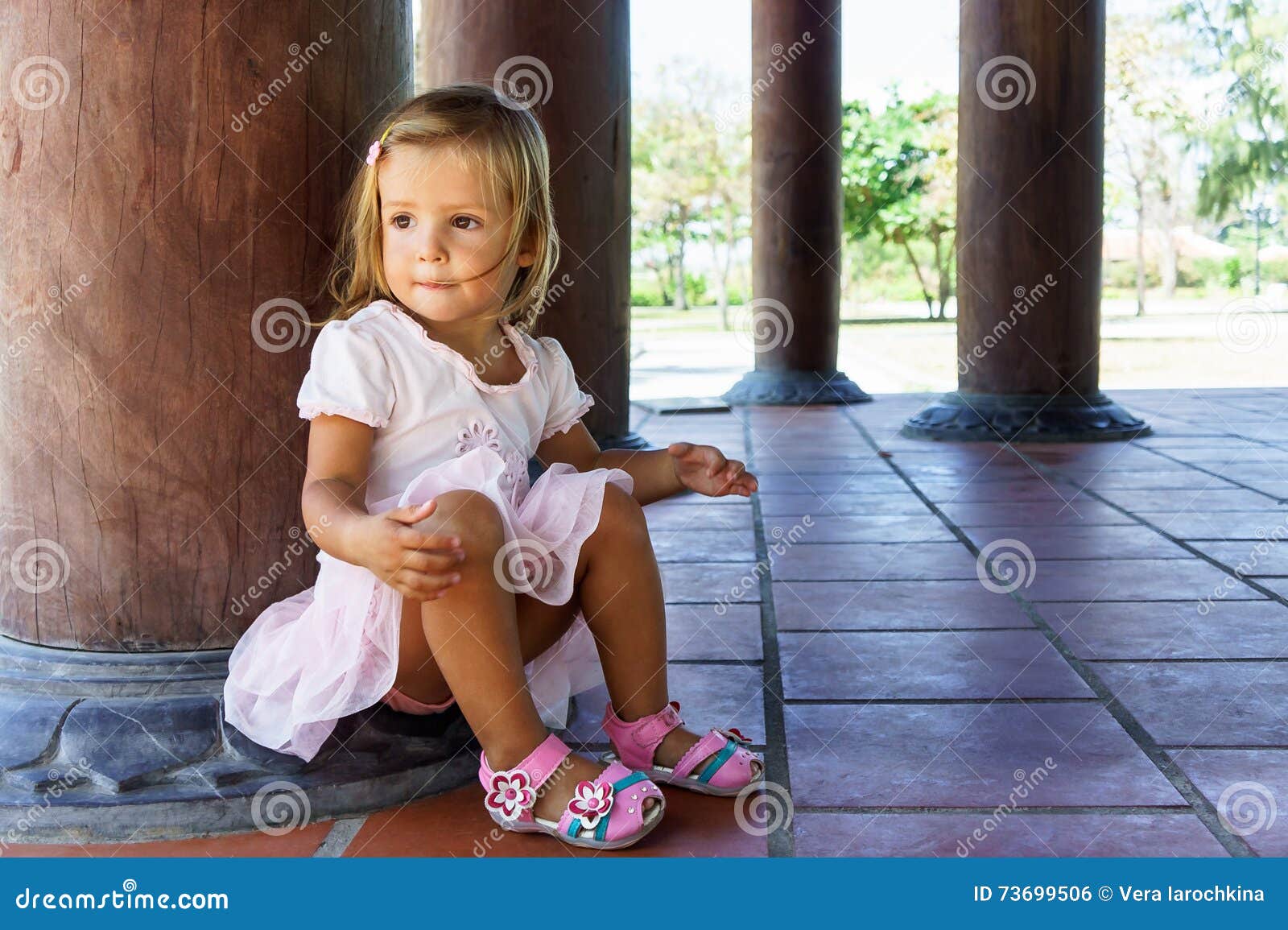 Little Girl Sitting Near the Column Stock Photo - Image of flooring ...