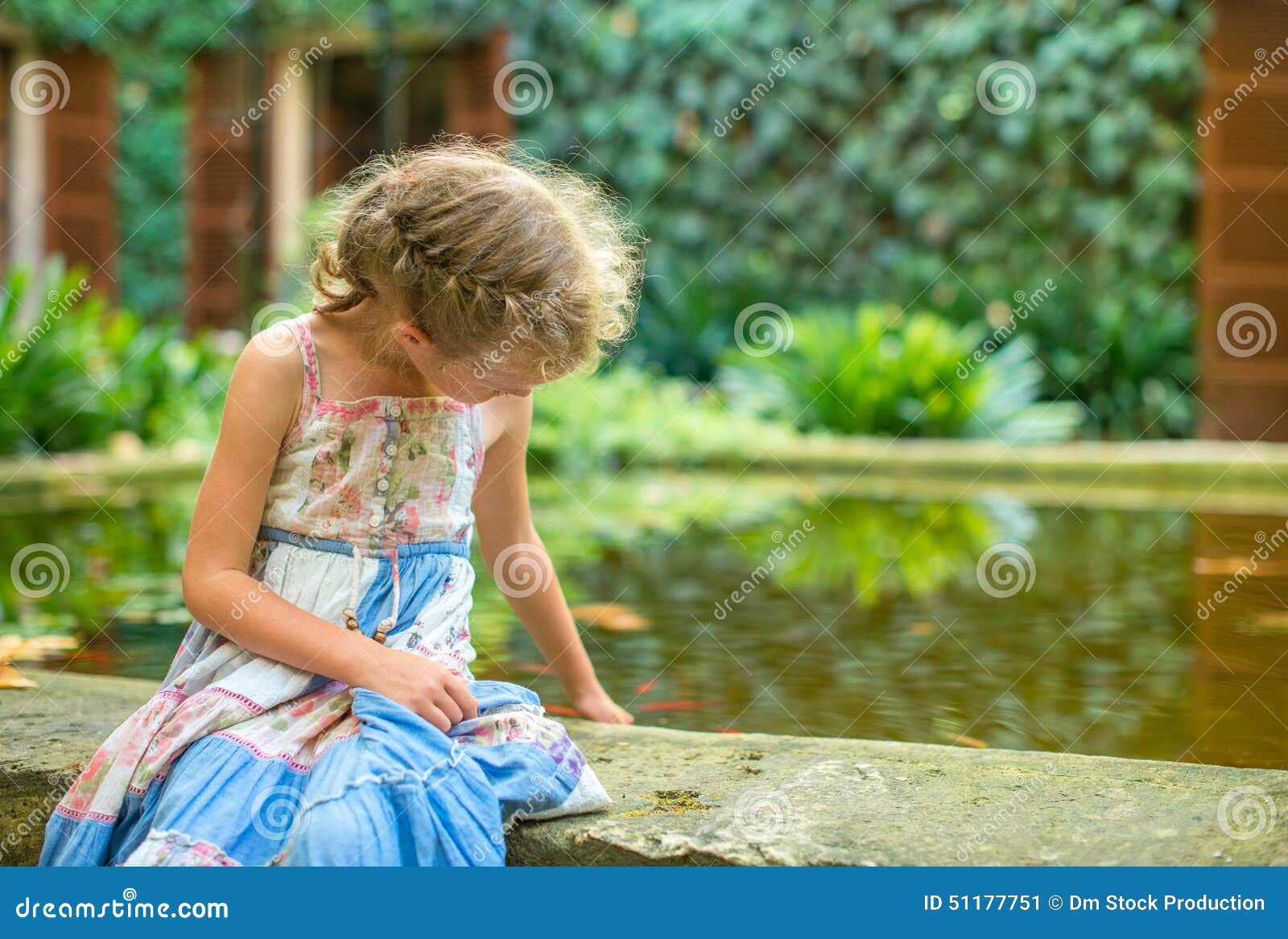 Little Girl Sitting by the Pond. Stock Image - Image of little, playing ...