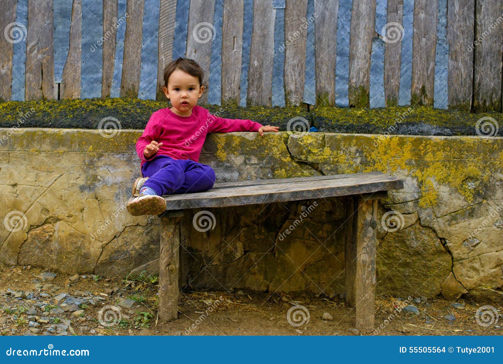Little Girl Sitting on a Rustic Bench Stock Photo - Image of playing ...