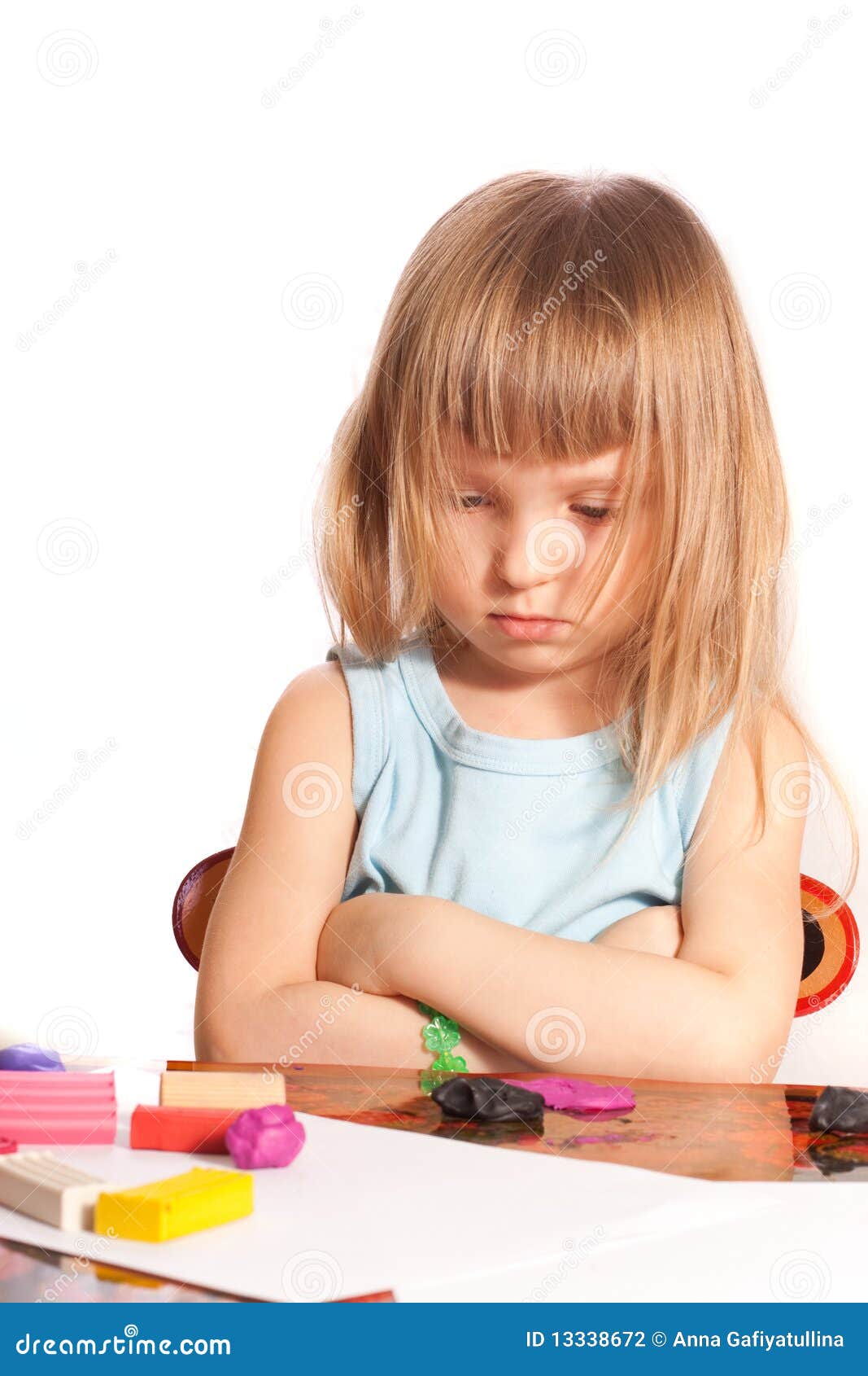 Little Girl Sitting at a Table Stock Photo - Image of colored, white ...