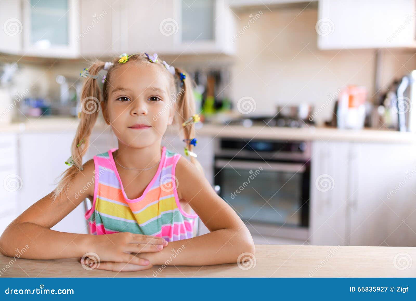 Little Girl Sitting at Table Stock Image - Image of girl, happy: 66835927