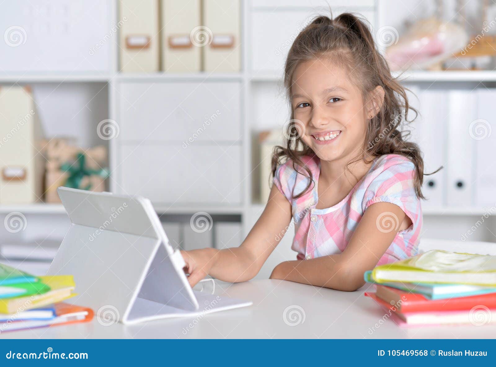 Little girl using tablet stock photo. Image of little - 105469568