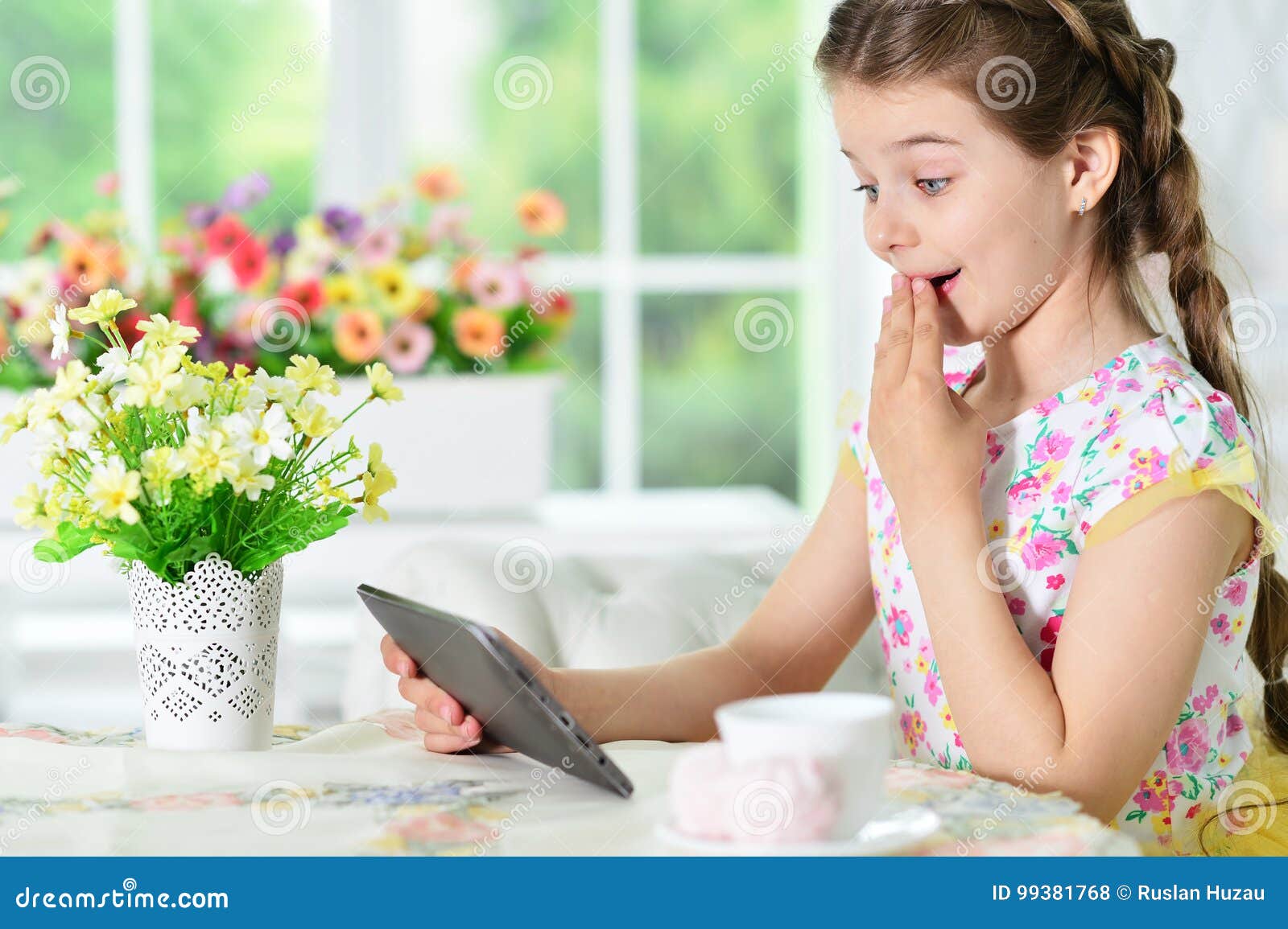 Little girl using tablet stock photo. Image of european - 99381768