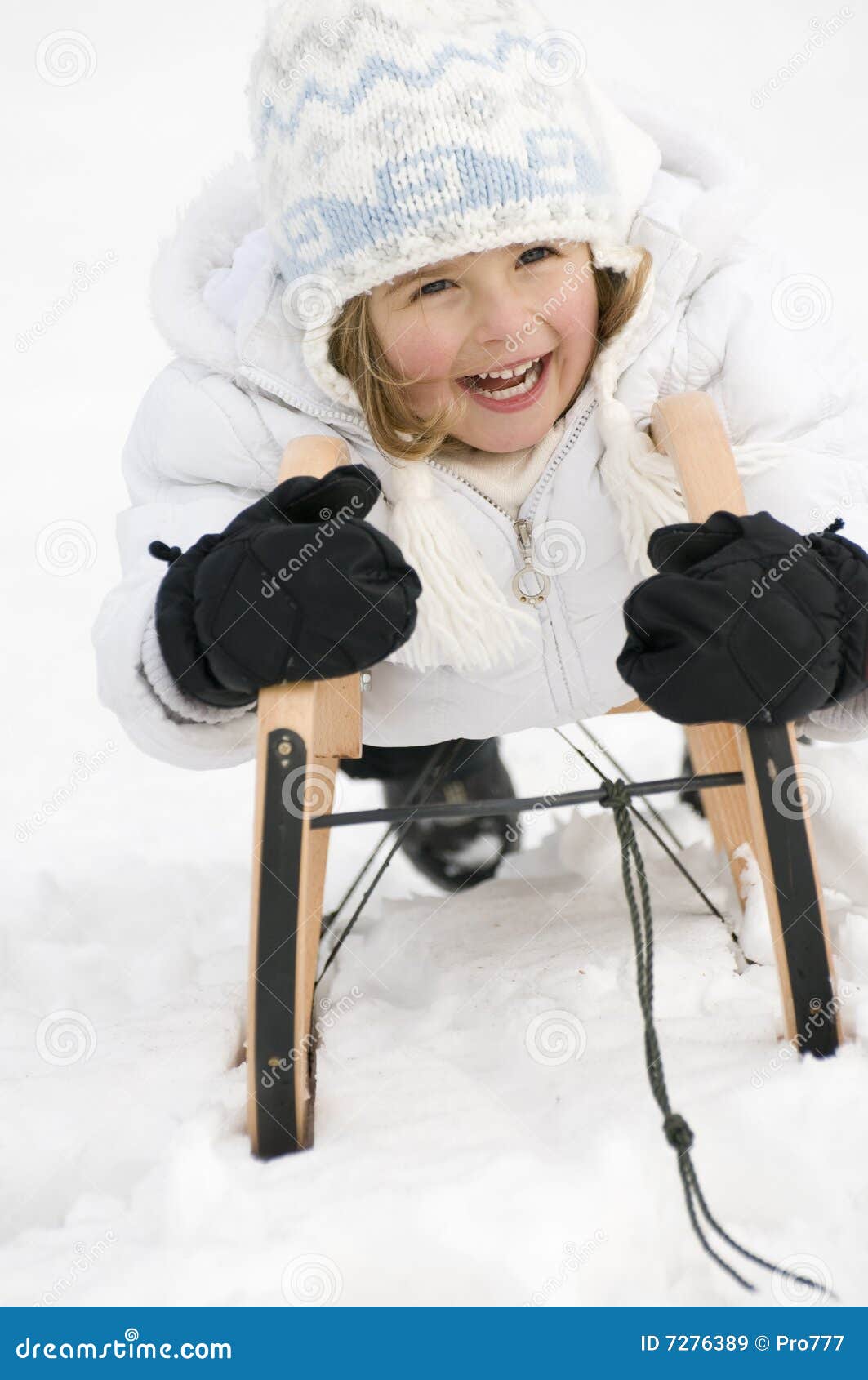 Little girl on sledge stock image. Image of happiness - 7276389