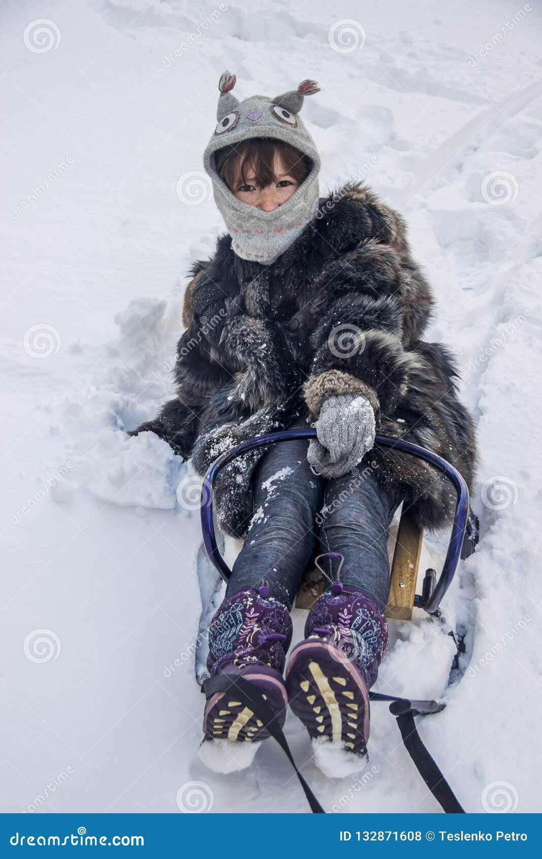 Little girl on sledge stock photo. Image of girl, season - 132871608