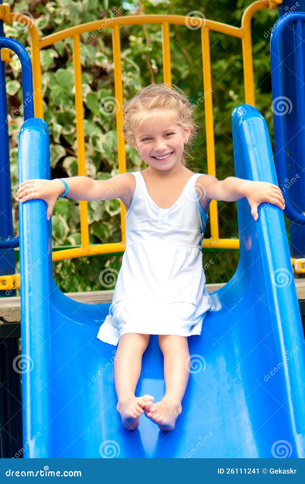 Little girl on slide stock image. Image of recreational - 26111241