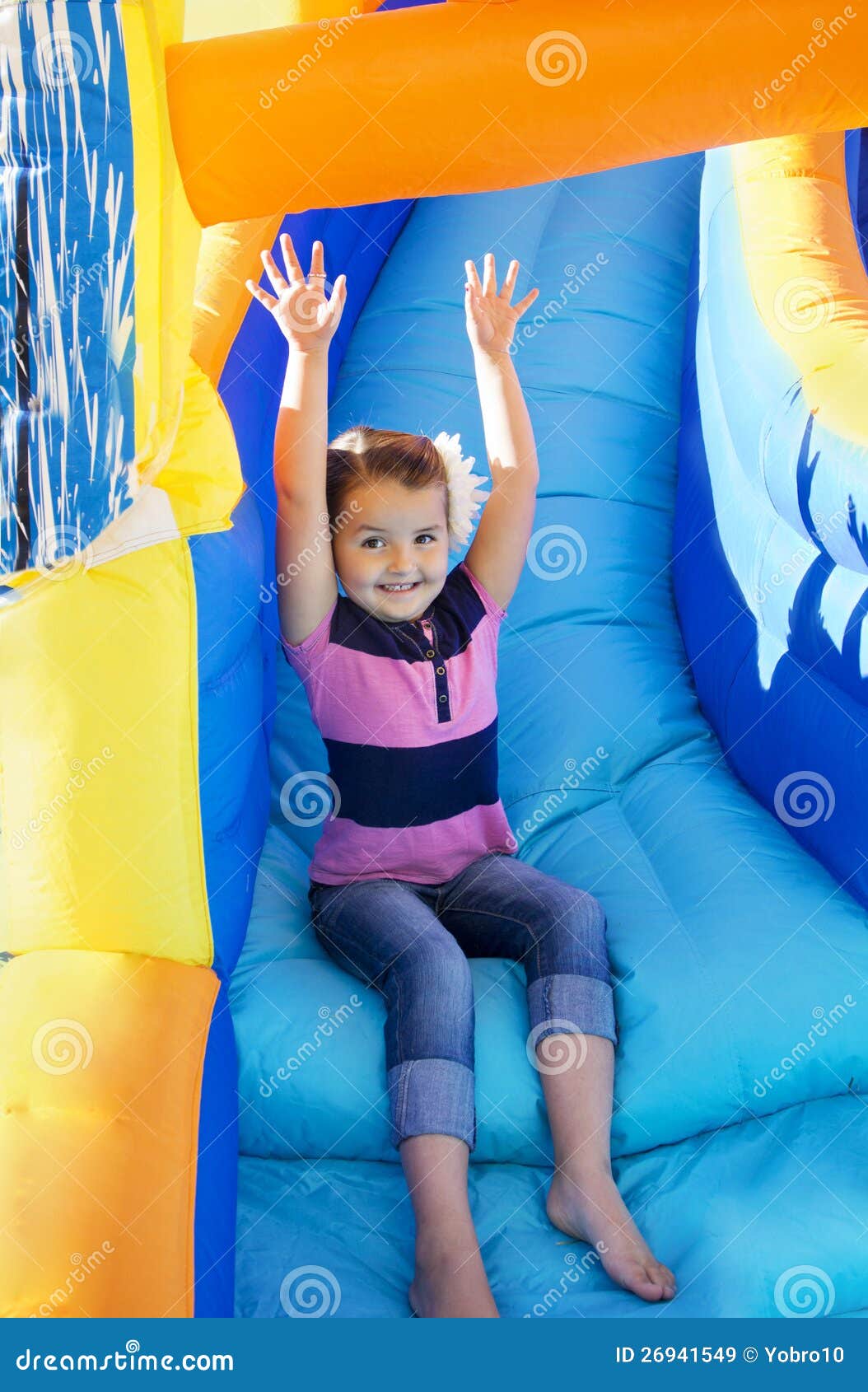 Little Girl Sliding Down an Inflatable Slide Stock Image - Image of ...
