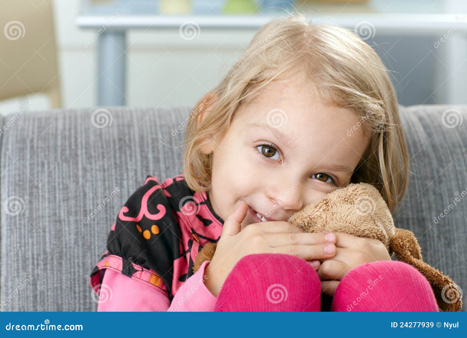 Little Girl Smiling Impishly on Sofa Stock Image - Image of cute, four ...
