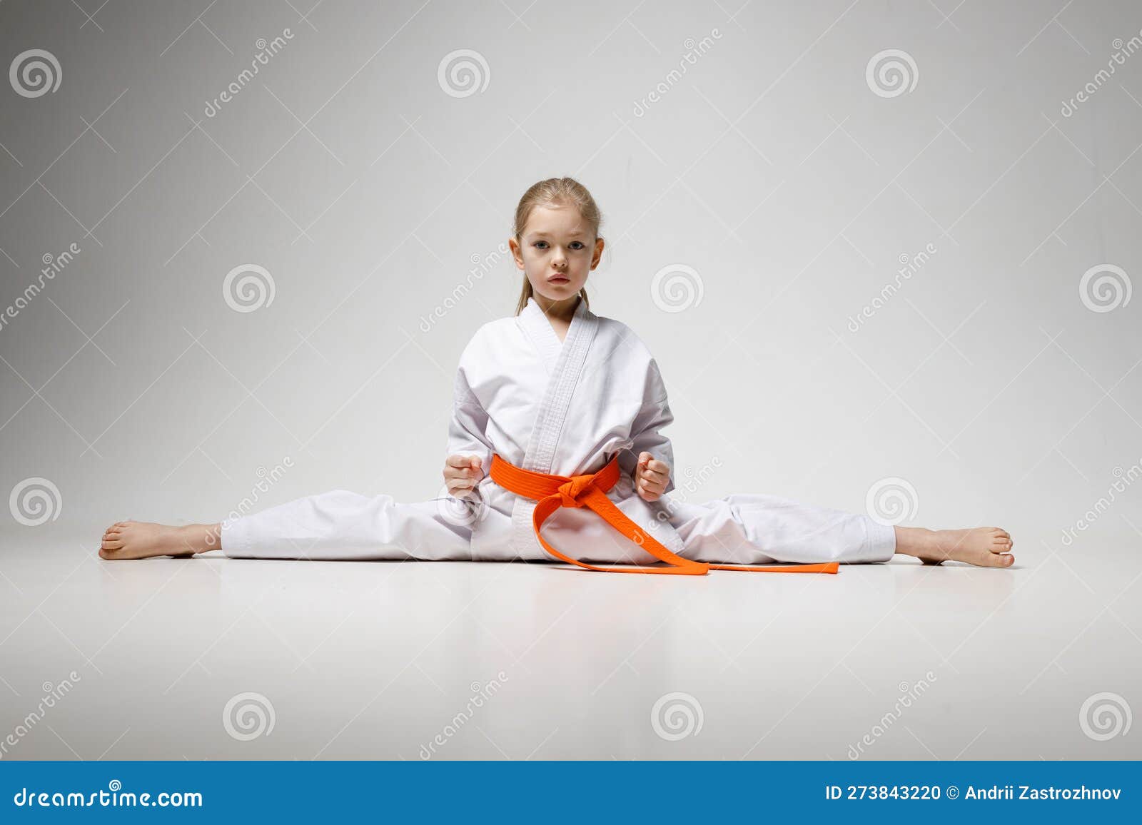 Little Girl in a Split Pose on a White Background, Child Karate Fighter ...