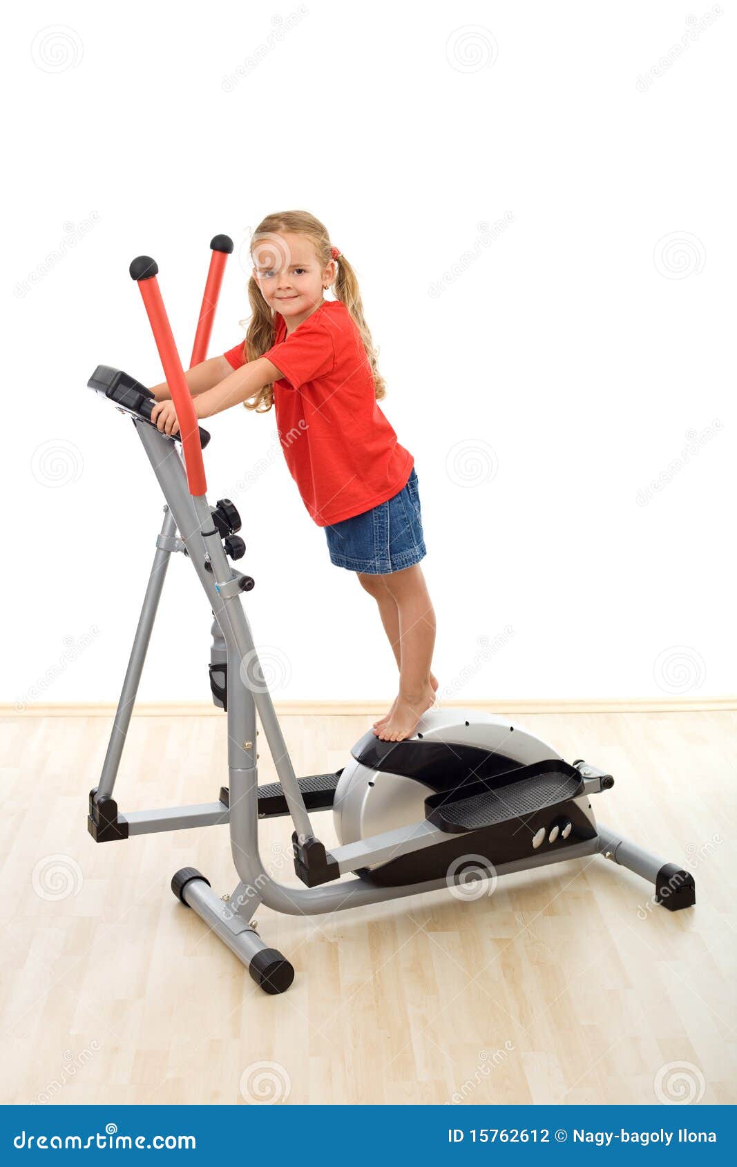 Little Girl Standing on Top of Elliptical Trainer Stock Photo - Image ...