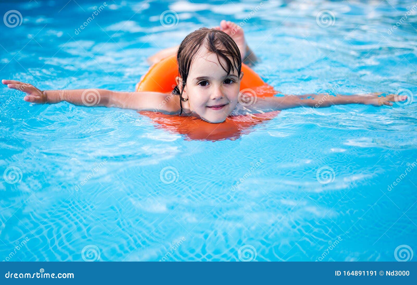 Little Girl in Swimming Pool with Float Ring Stock Image - Image of ...