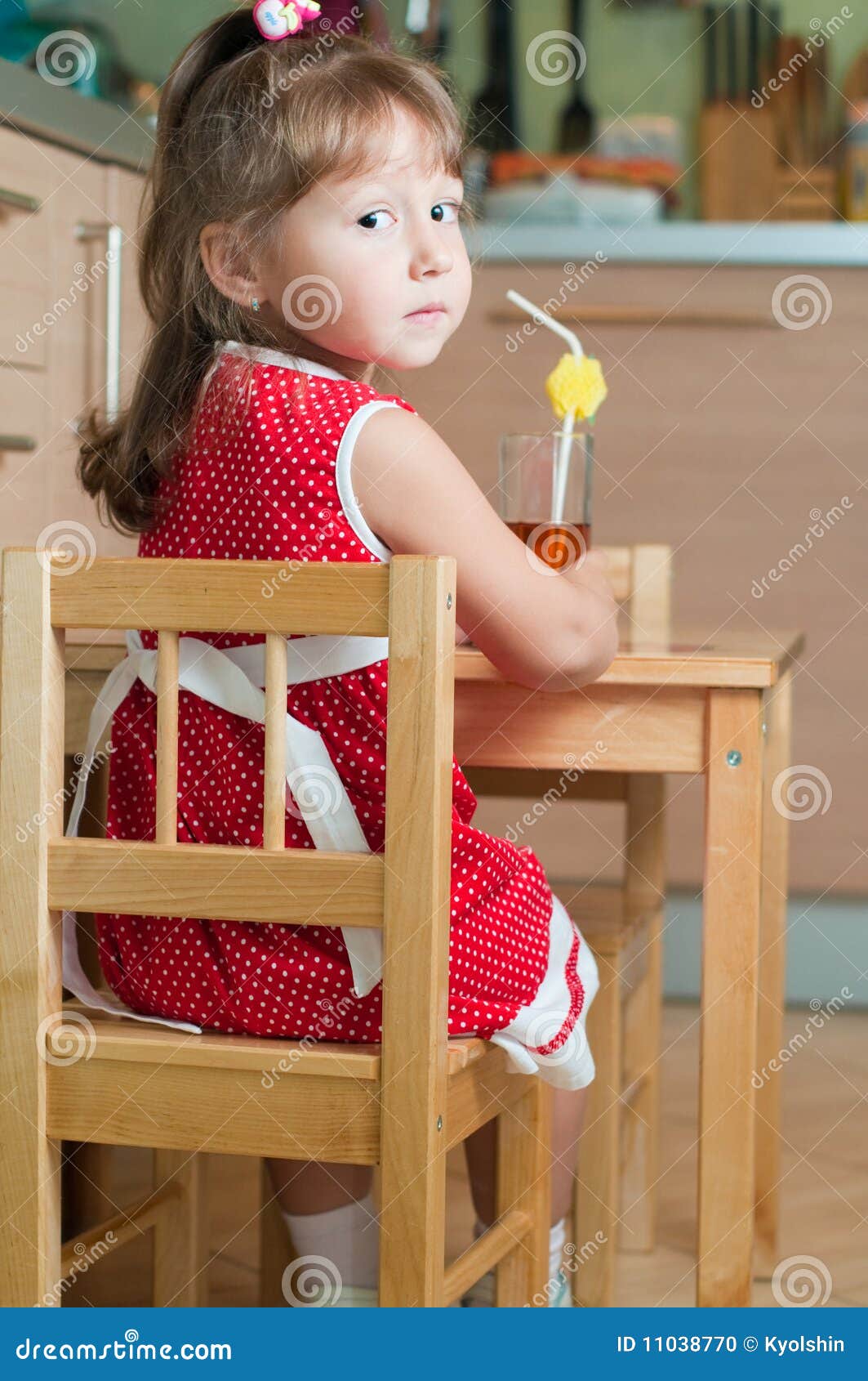 A little girl at a table stock photo. Image of girl, daughter - 11038770