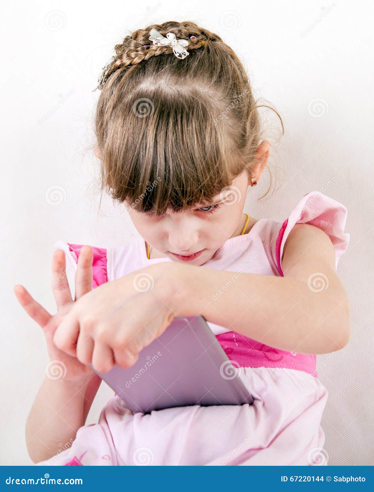 Little Girl with Tablet stock photo. Image of face, idle - 67220144