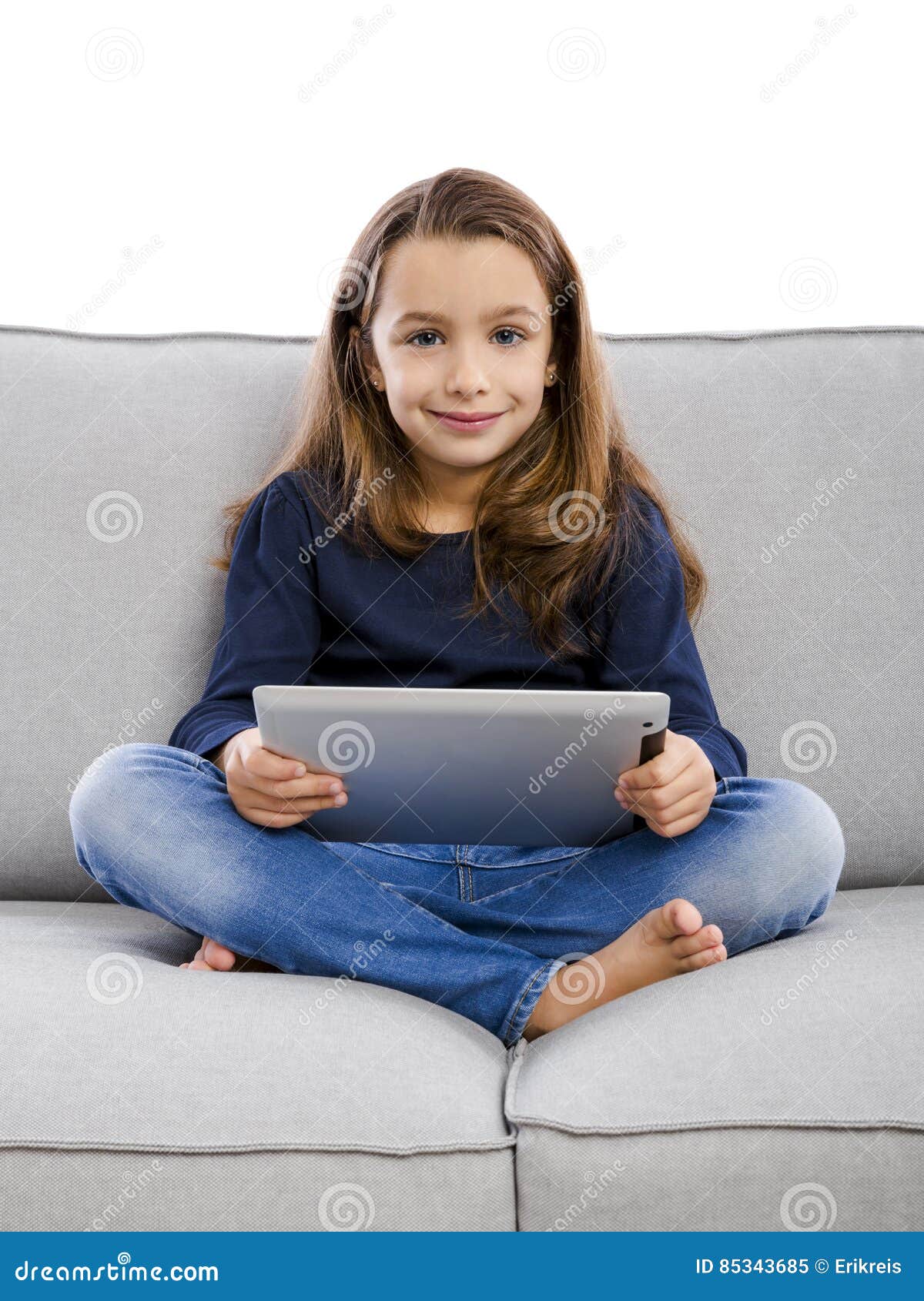 Little girl with a tablet stock image. Image of casual - 85343685