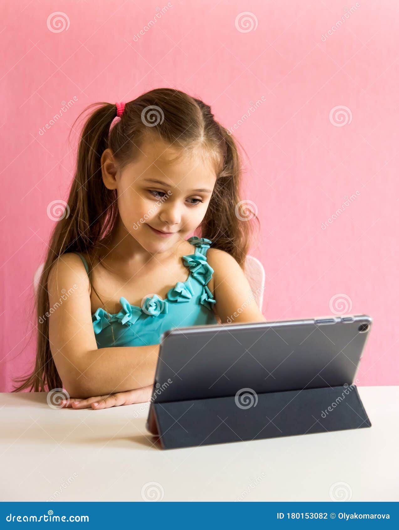 Little Girl with a Tablet at the Table Stock Photo - Image of learning ...