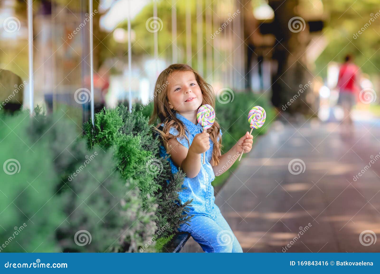 Little Girl is Taste Candy on a Stick Stock Photo - Image of copy ...