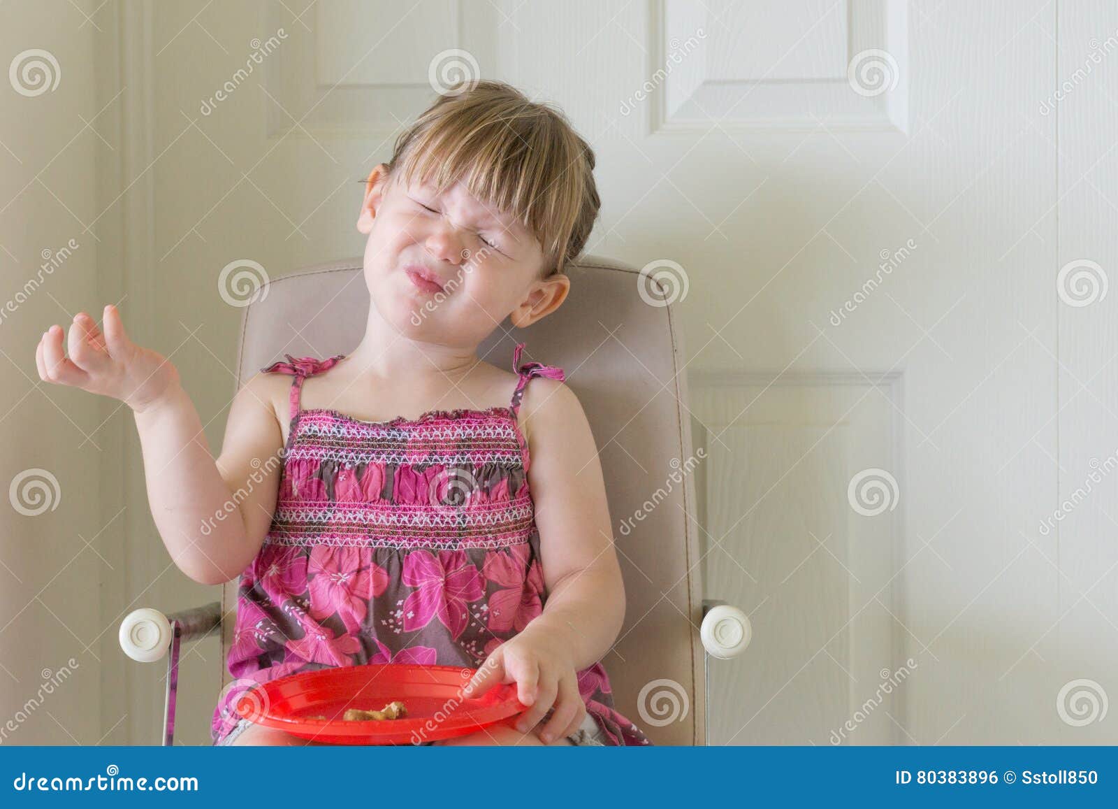 Little girl tasting food stock photo. Image of expressive - 80383896