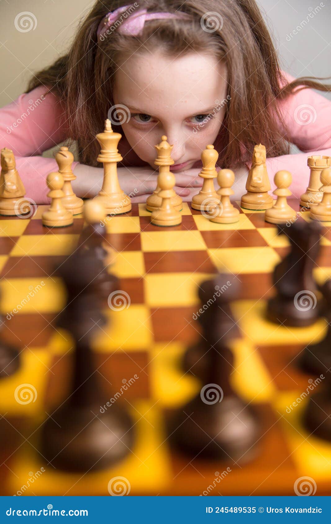 Little girl playing chess stock image. Image of smart - 245489535