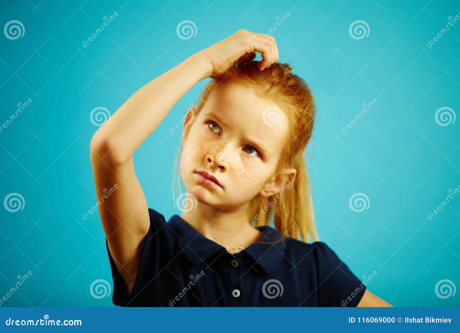 Little Girl with Thoughtful Expression Scratching Head and Looking Up ...