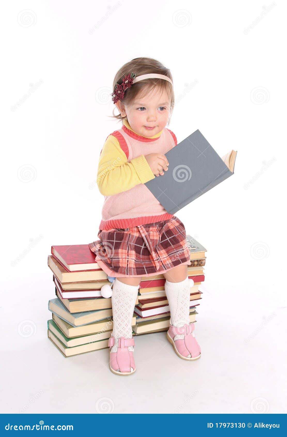 Little Girl Thoughtfully Reading a Book Stock Photo - Image of person ...