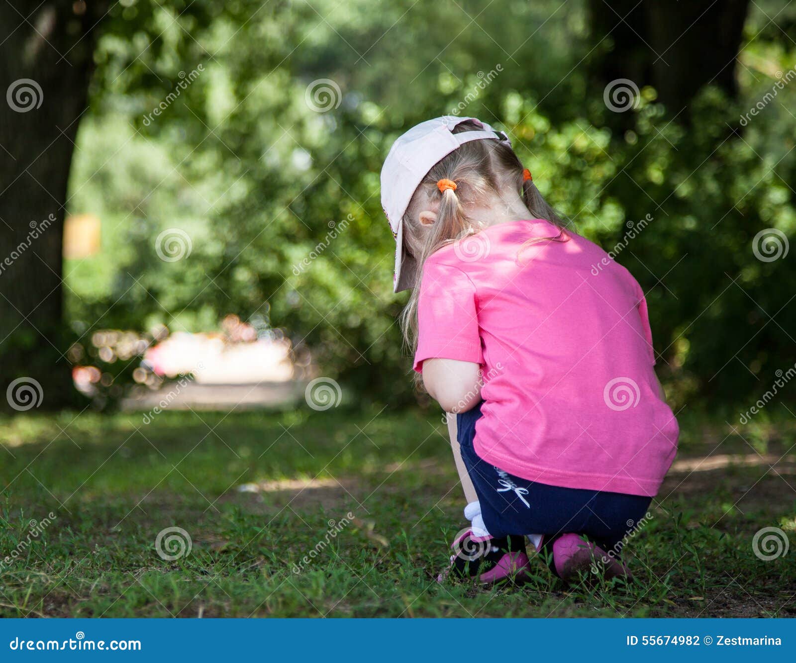 Little girl turning back stock photo. Image of park, brushwood - 55674982