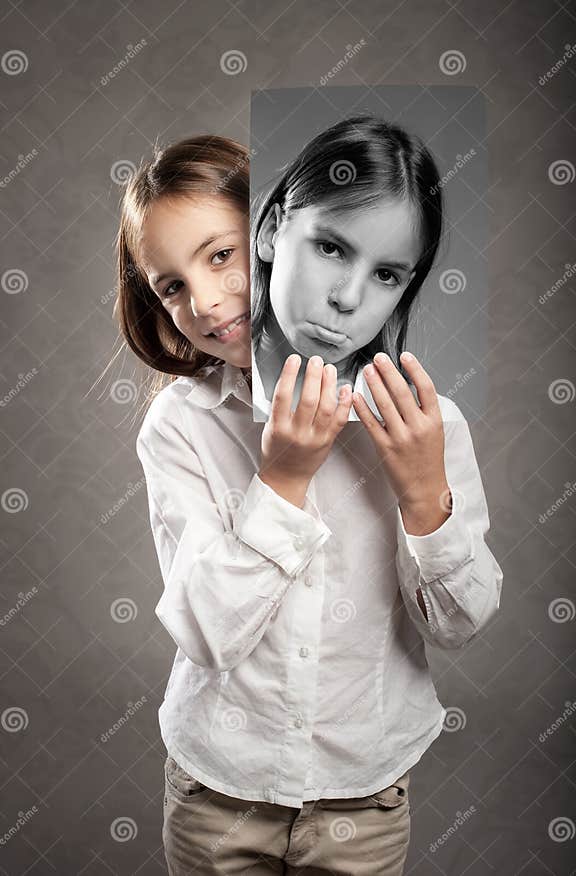 Little girl with two faces stock photo. Image of emotion - 27893268