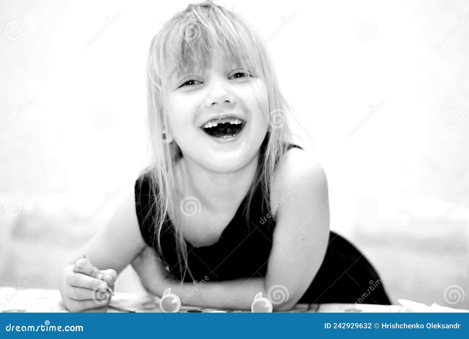A Little Girl without Two Front Teeth Gaily Smiling Stock Photo - Image ...