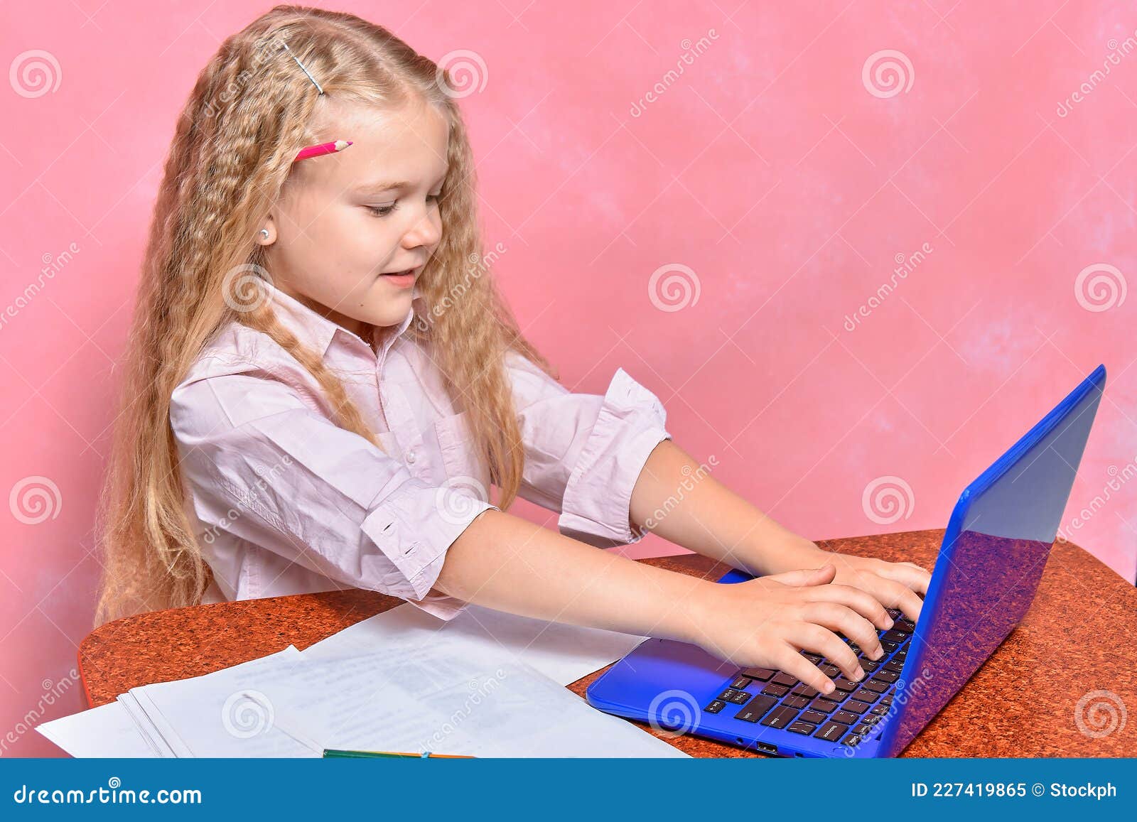 Little Girl is Typing at the Laptop. Online Learning Stock Image ...