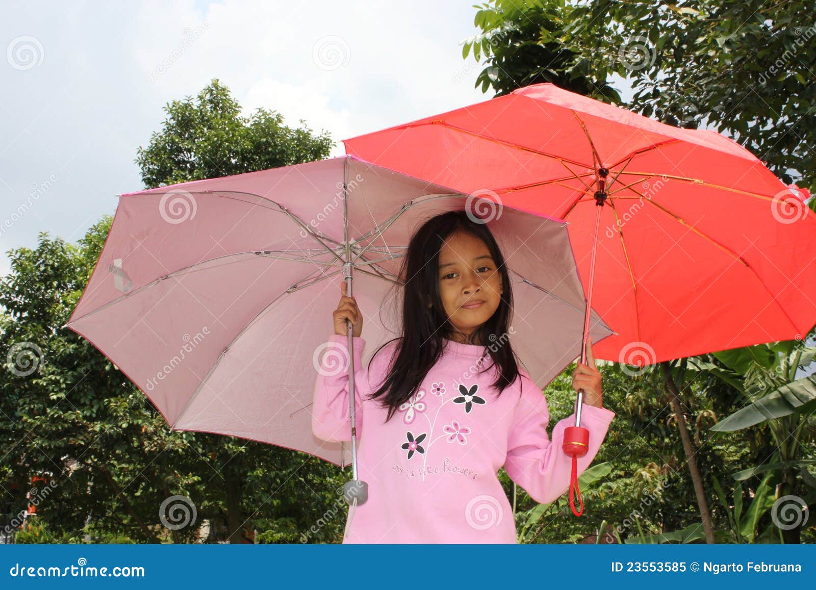 Little Girl Under Umbrellas Stock Image - Image of cute, person: 23553585