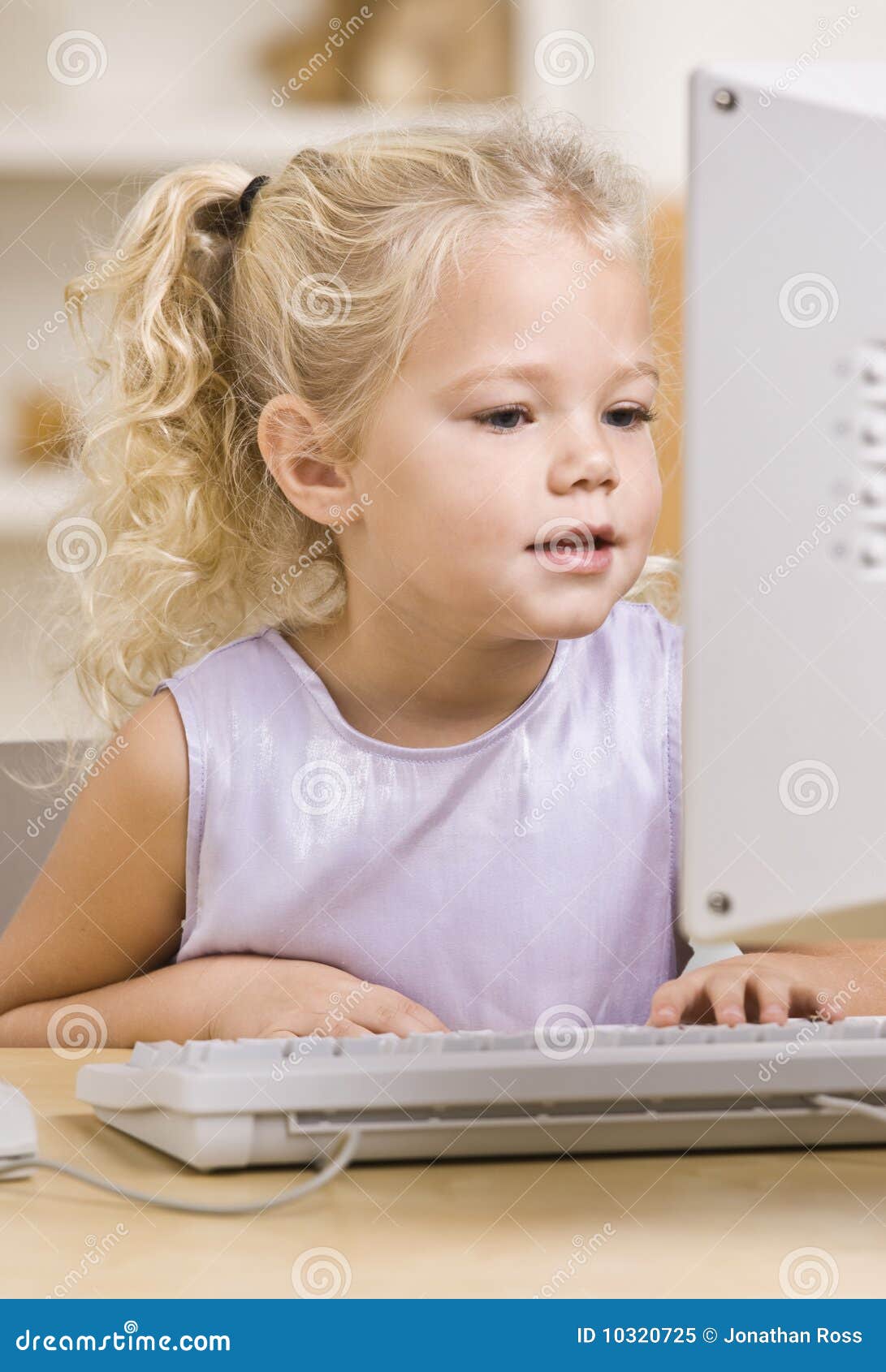 Little Girl Using Computer stock image. Image of sitting - 10320725