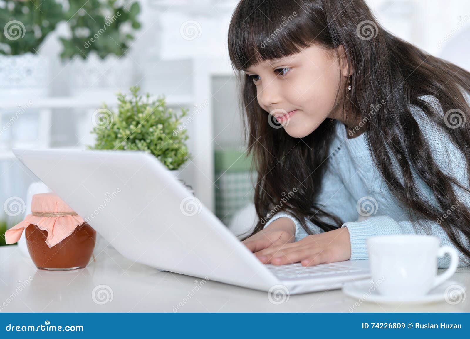 Little girl using computer stock image. Image of game - 74226809