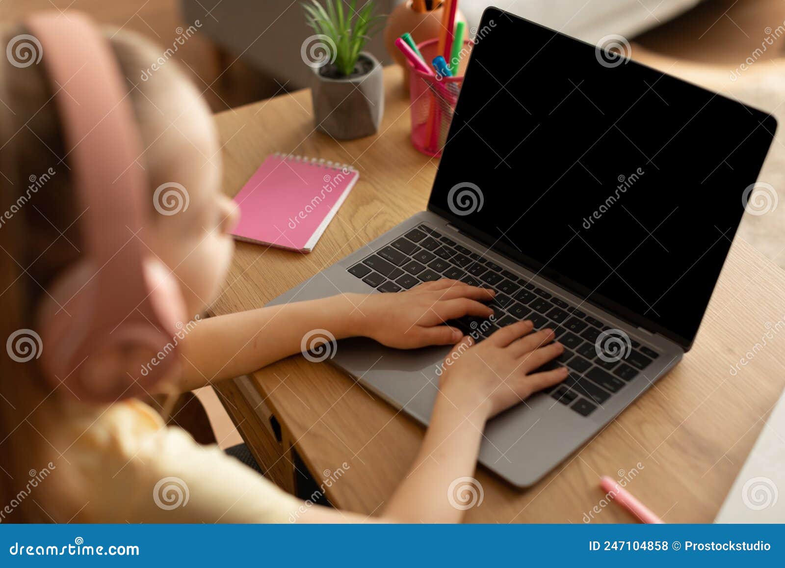 Little Girl Using Laptop Computer with Blank Screen Learning Indoors ...