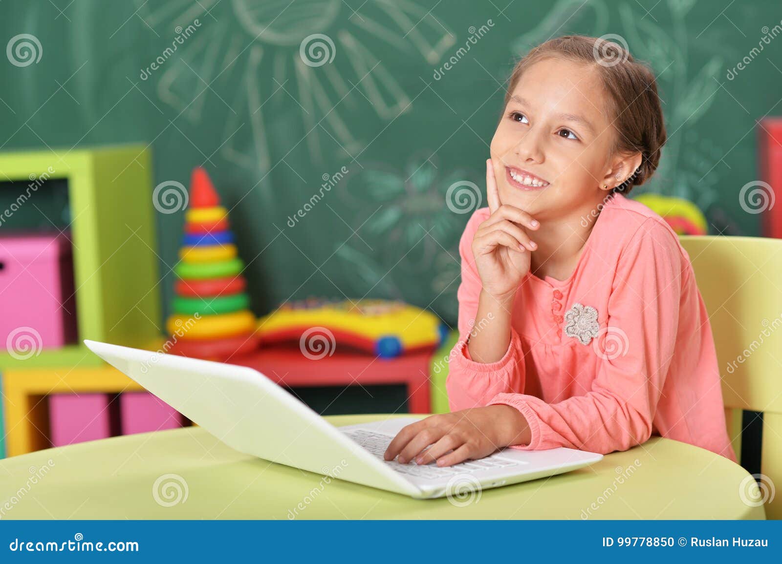 Little girl using laptop stock photo. Image of face, laptop - 99778850