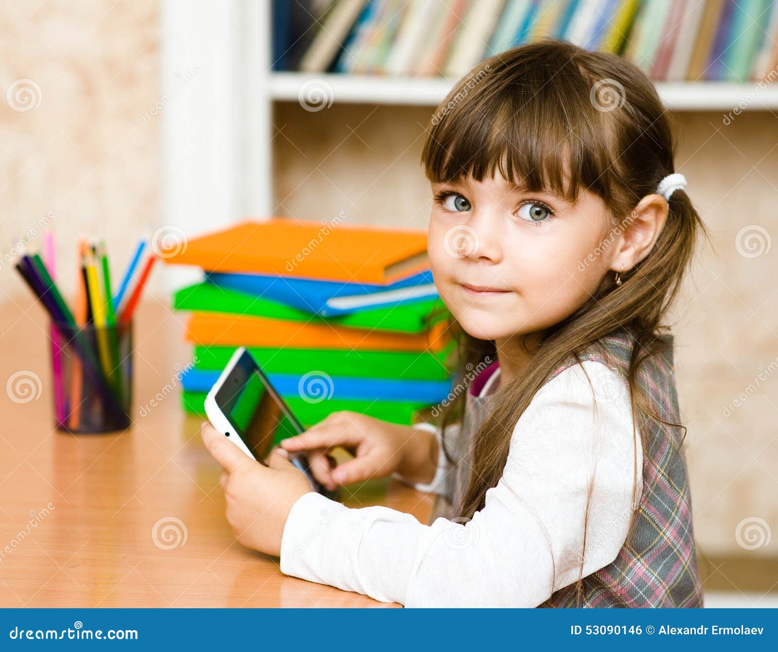 Little Girl Using Tablet Computer. Looking at Camera Stock Photo ...