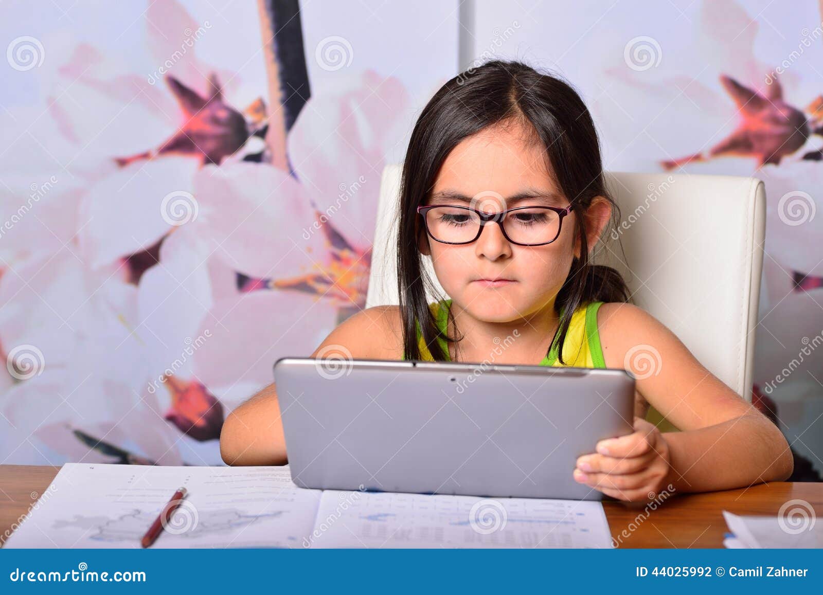 Little Girl Using a Tablet PC for Homework Stock Photo - Image of ...