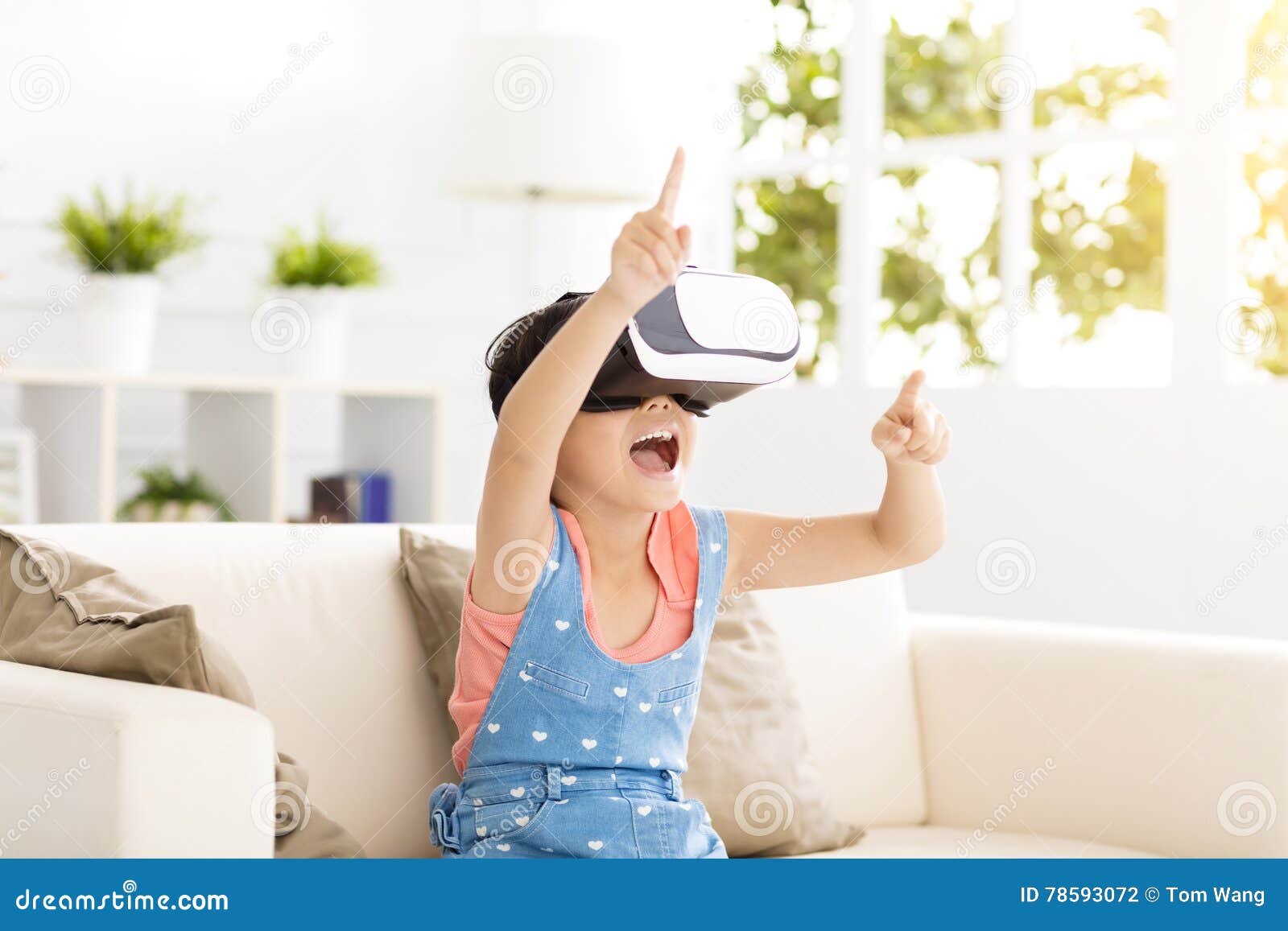 Little Girl with Virtual Reality Headset Sitting on Sofa Stock Photo ...