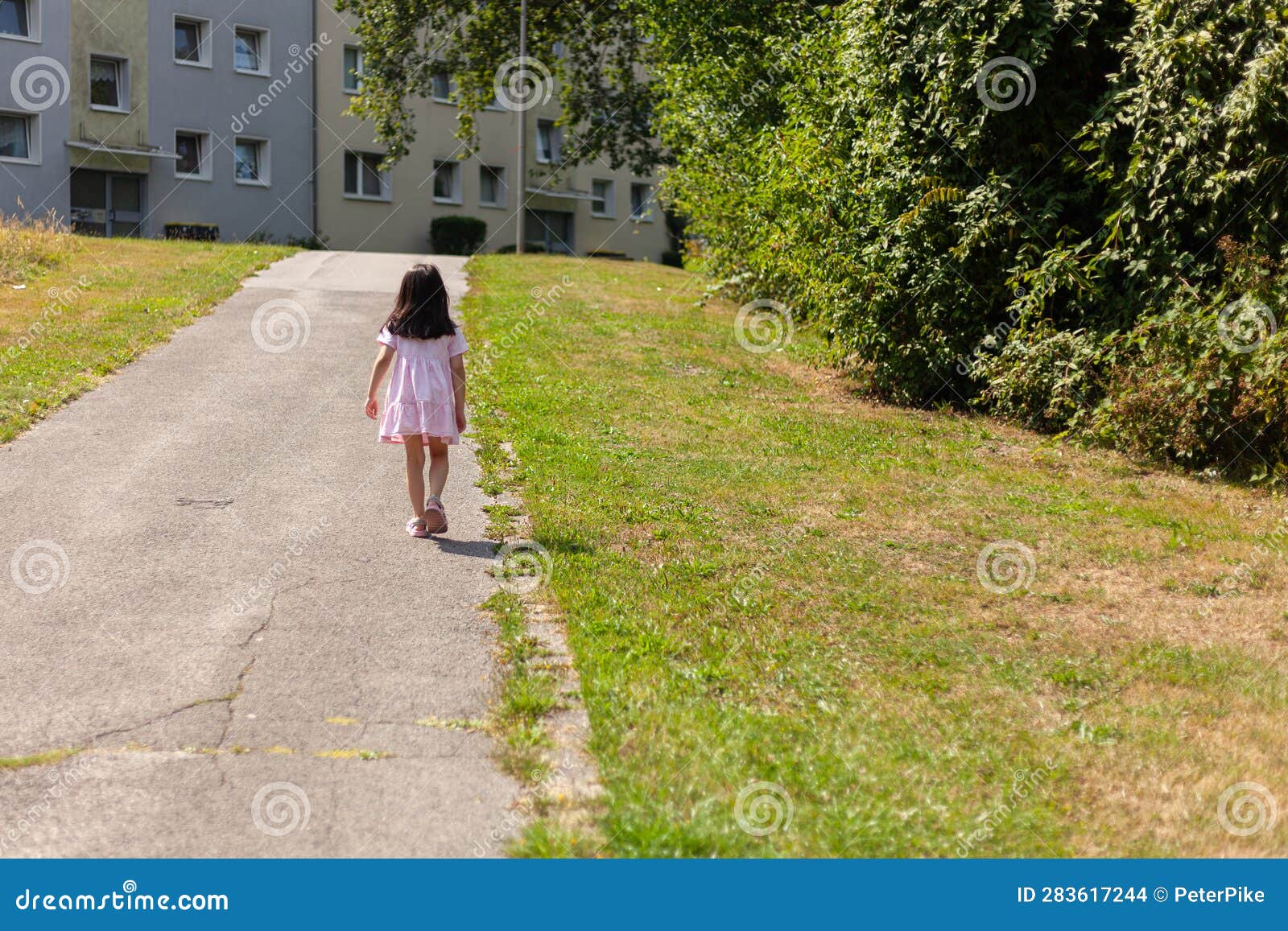 Little Girl Walking on the Path in the Park. Back View Stock Photo ...