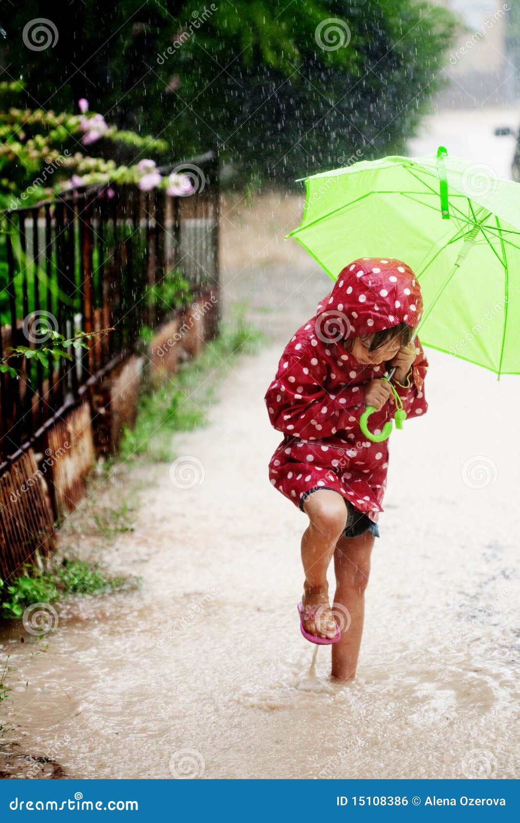 Little Girl Walking in the Rain Stock Photo - Image of puddle, hood ...