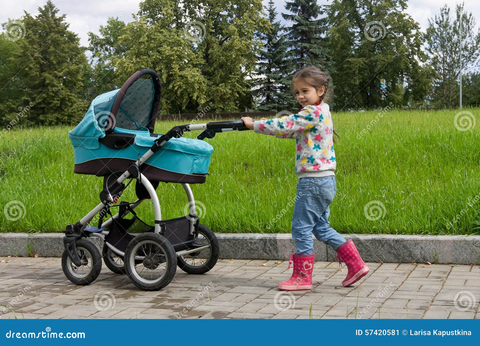 Little Girl Walking with Stroller Stock Image - Image of park, lawn ...