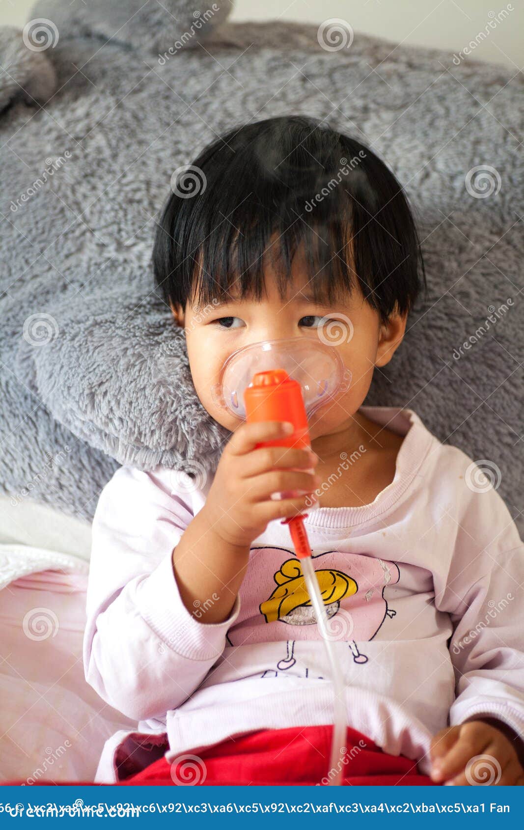 The Little Girl Who is Undergoing Atomization Therapy Stock Photo ...