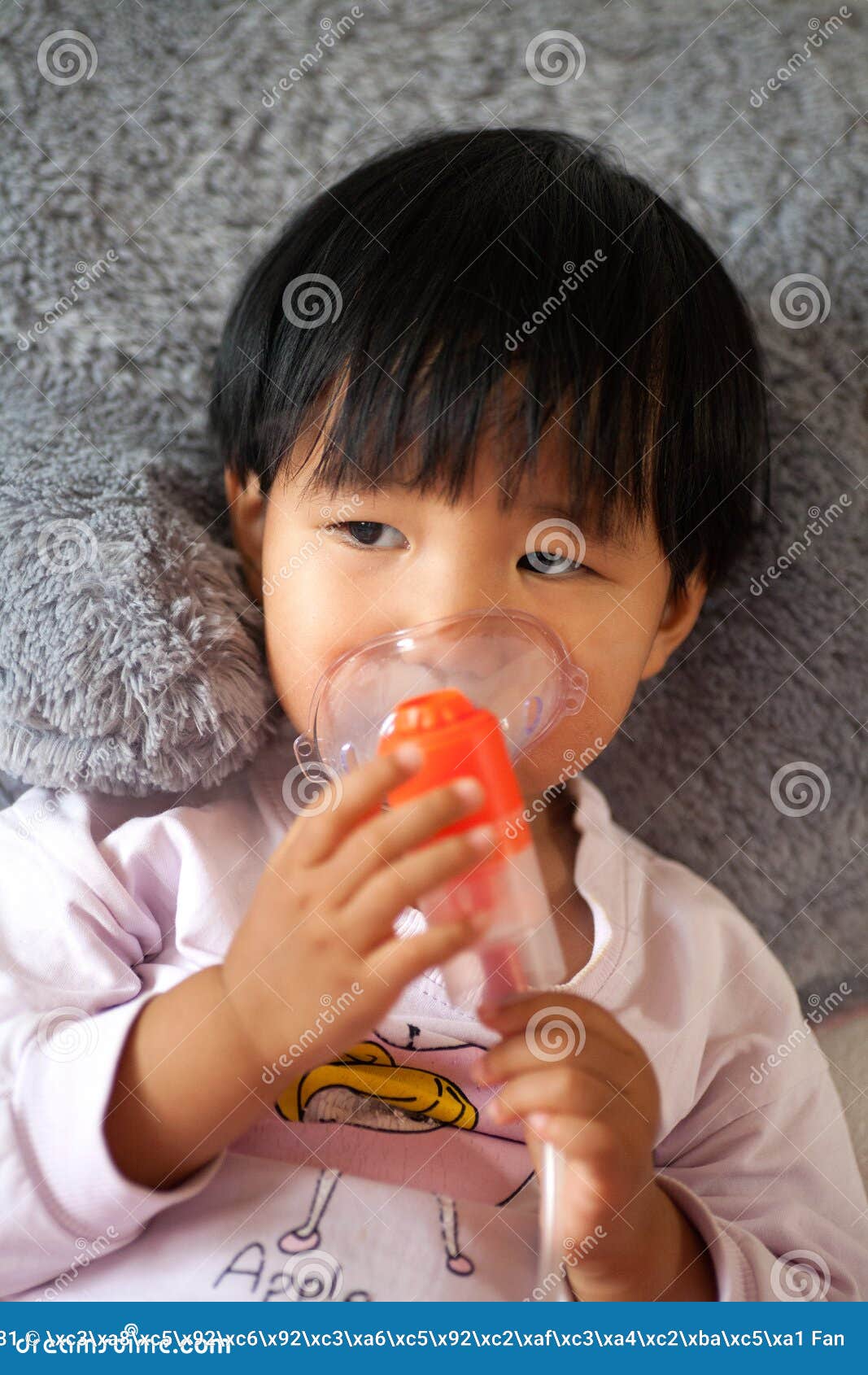 The Little Girl Who is Undergoing Atomization Therapy Stock Image ...