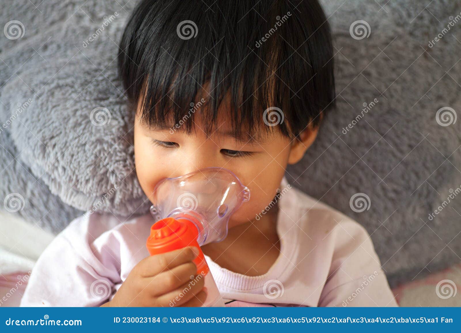 The Little Girl Who is Undergoing Atomization Therapy Stock Photo ...