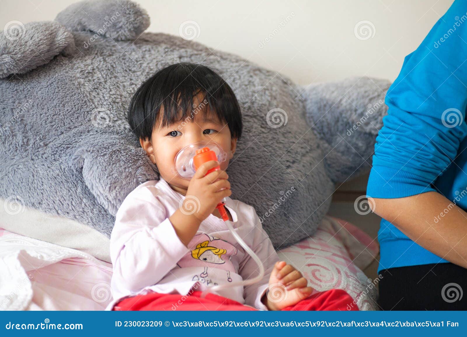 The Little Girl Who is Undergoing Atomization Therapy Stock Image ...